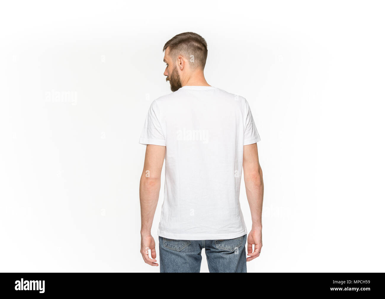 Closeup of young man's body in empty white t-shirt isolated on white ...