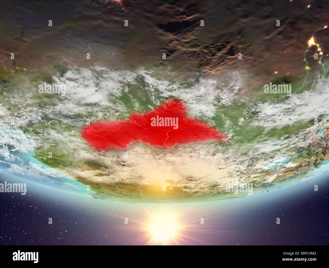 Central Africa during sunrise highlighted in red on planet Earth with clouds. 3D illustration ...