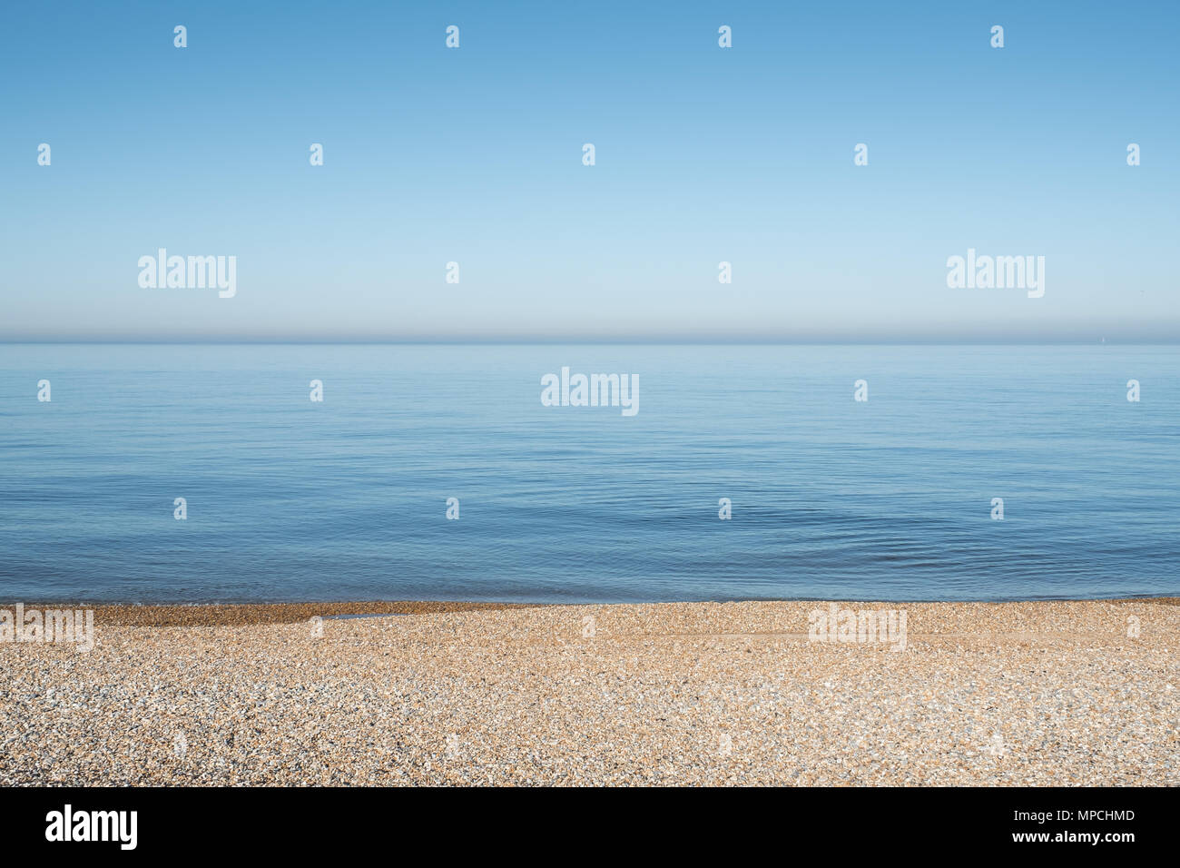 Shingle Beach & blue Sea Stock Photo - Alamy