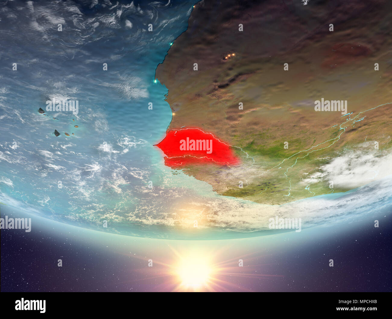 Senegal during sunrise highlighted in red on planet Earth with clouds ...