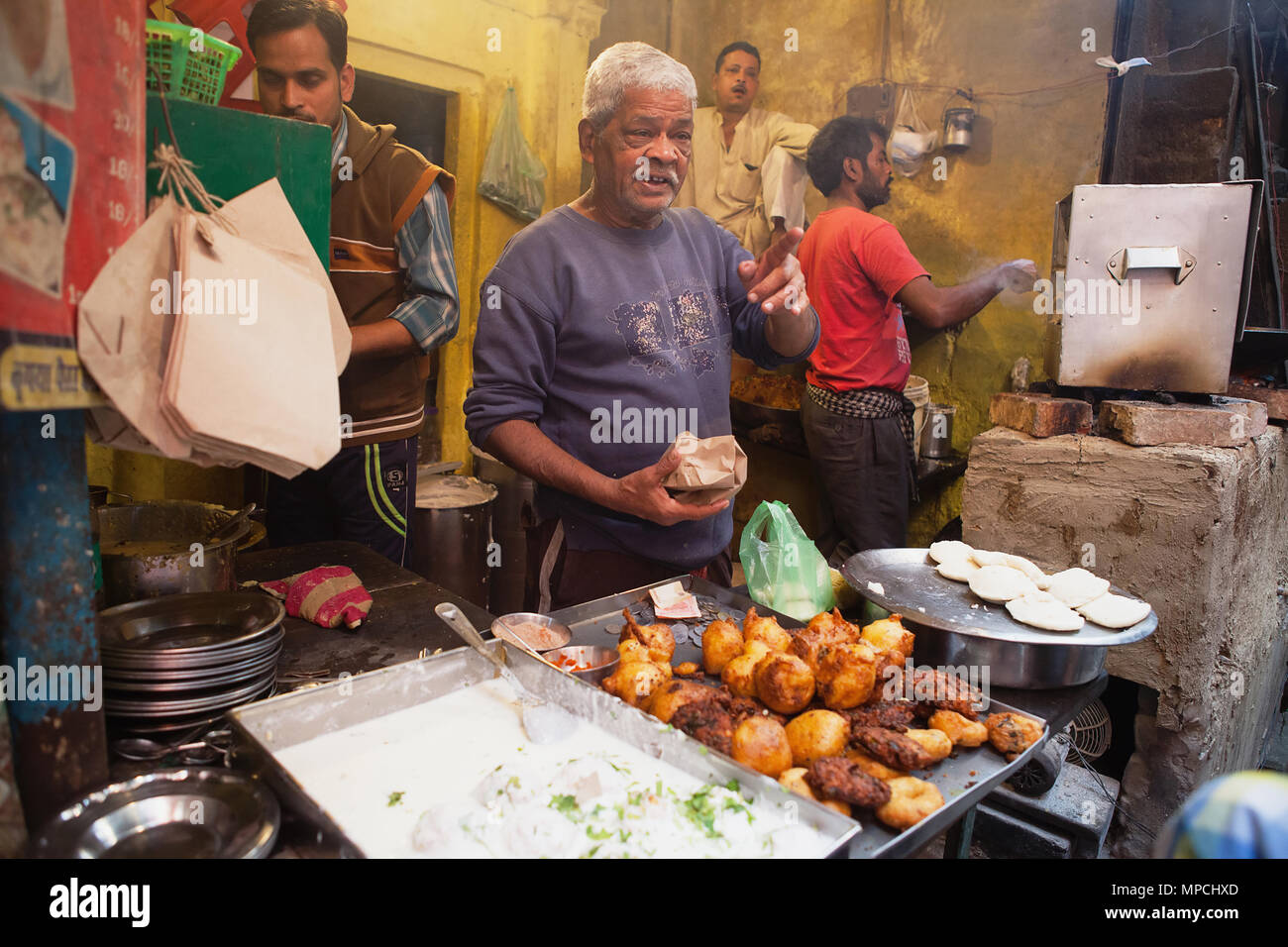 India, Uttar Pradesh, Varanasi, A food hotel serving idlis & dahl vada ...