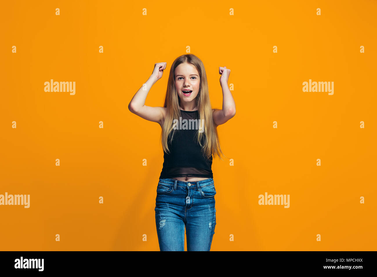 Happy success teen girl celebrating being a winner. Dynamic energetic ...