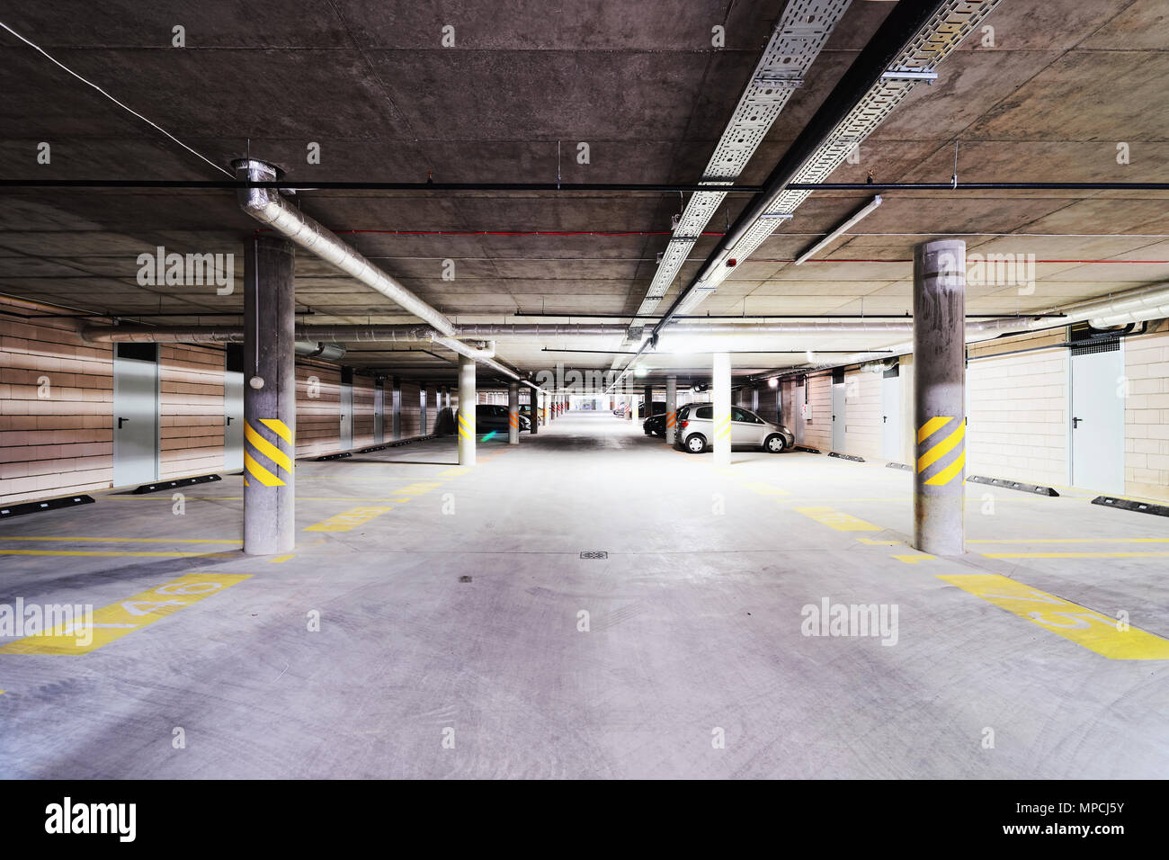 Underground Parking garage at a modern building Stock Photo - Alamy
