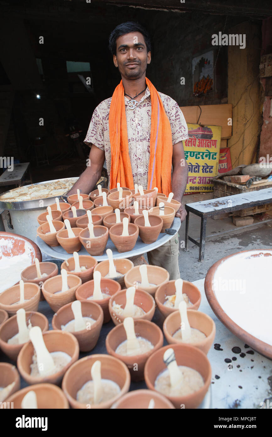 India, Uttar Pradesh, Allahabad, A vendor selling mishti doi sweet curd ...