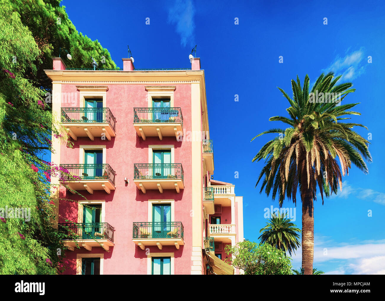 Building and palm tree in Taormina, Sicily, Italy Stock Photo - Alamy