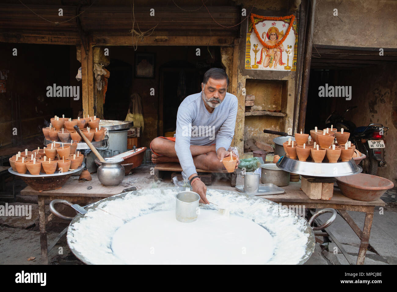 India, Uttar Pradesh, Allahabad, A vendor selling mishti doi sweet curd ...