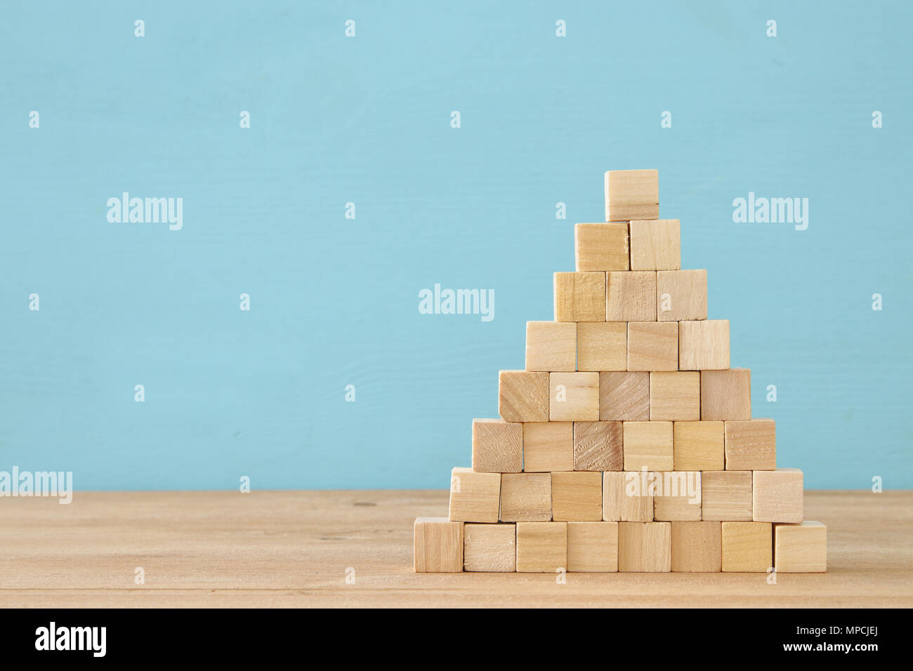 pyramid made from wooden cubes Stock Photo - Alamy