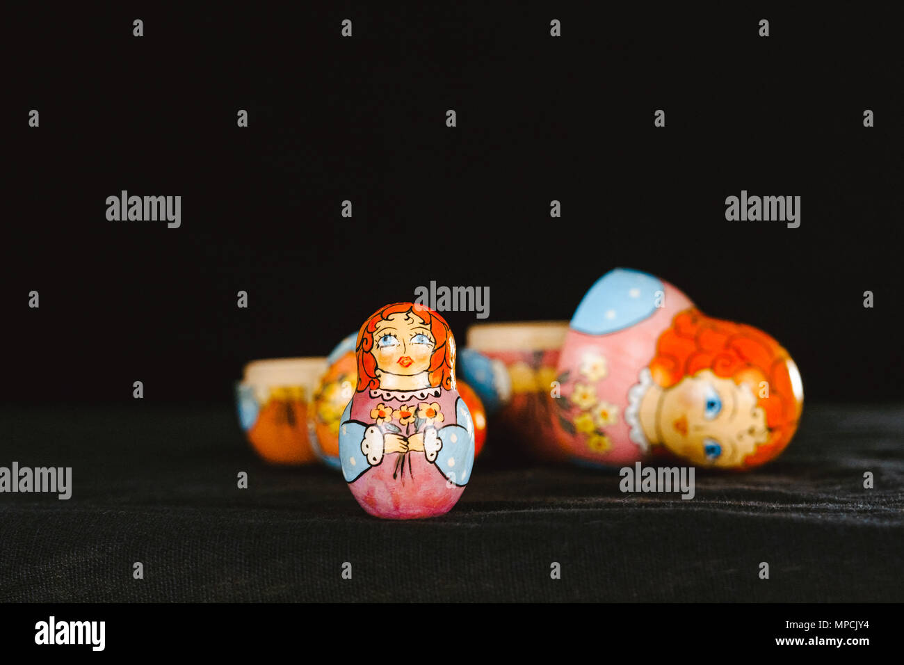 Russian nesting doll stands on a black background Stock Photo - Alamy