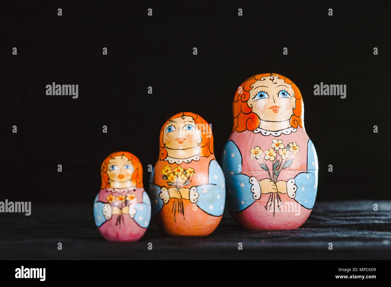 Russian nesting doll stands on a black background Stock Photo - Alamy