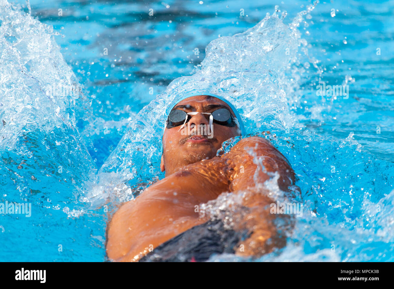 Backwards Swimming kids in the pool Stock Photo - Alamy