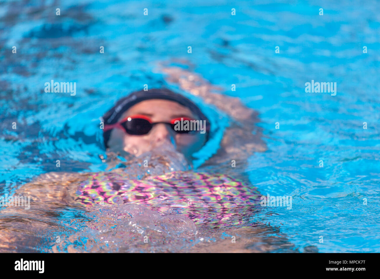 Backwards Swimming kids in the pool Stock Photo - Alamy