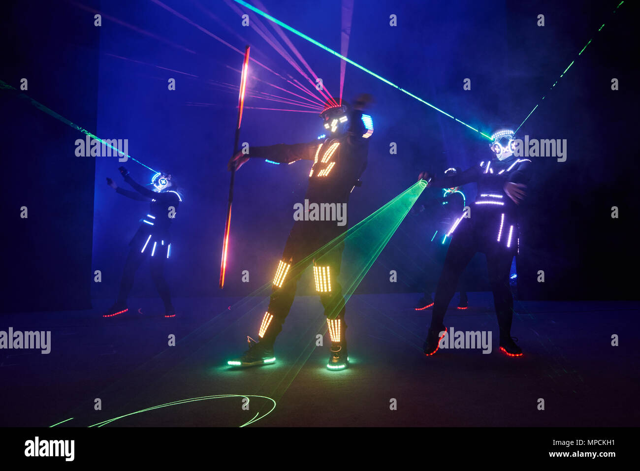 Laser show performance, dancers in led suits with LED lamp, very ...