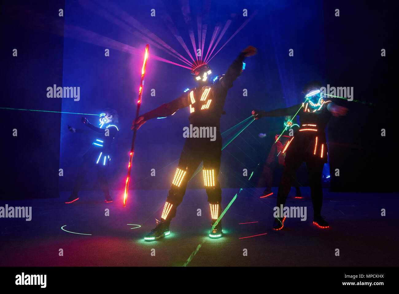 Laser show performance, dancers in led suits with LED lamp, very ...