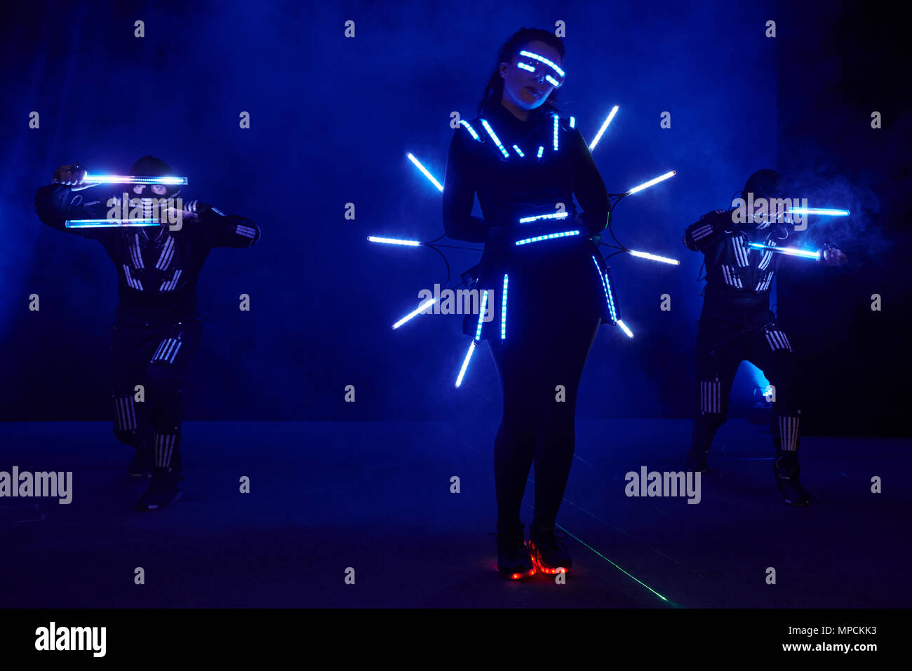 Laser show performance, dancers in led suits with LED lamp, very ...