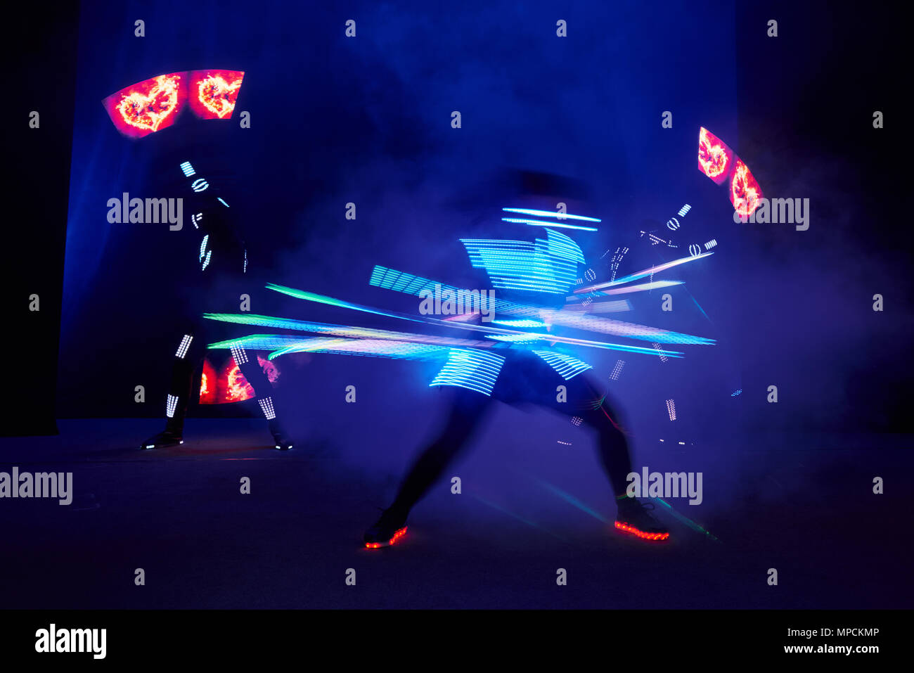 Laser show performance, dancers in led suits with LED lamp, very ...