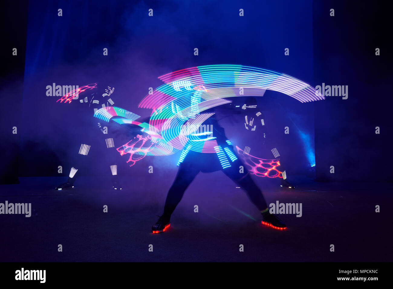 Laser show performance, dancers in led suits with LED lamp, very ...