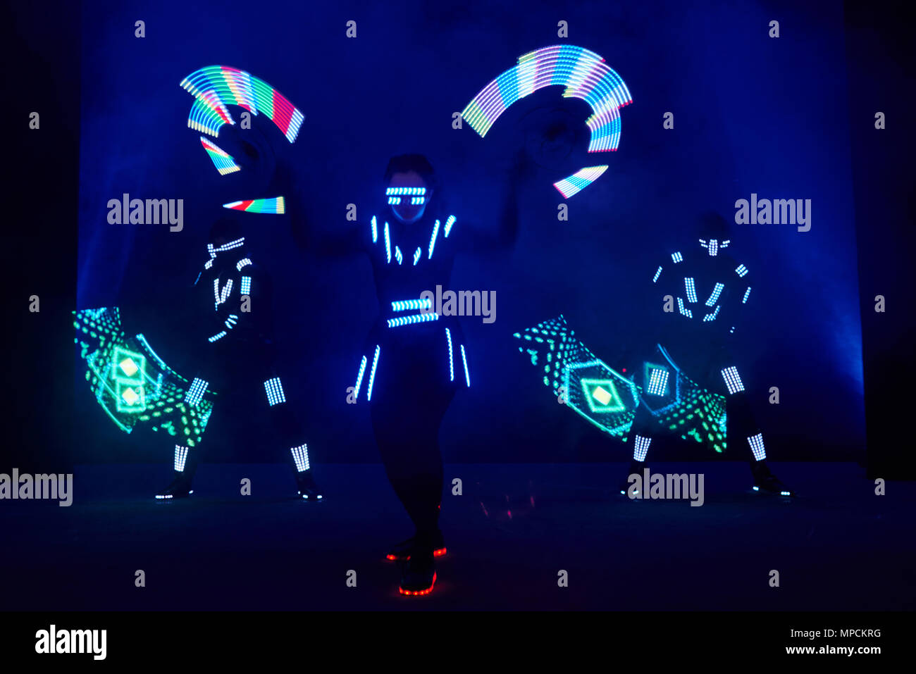 Laser show performance, dancers in led suits with LED lamp, very ...