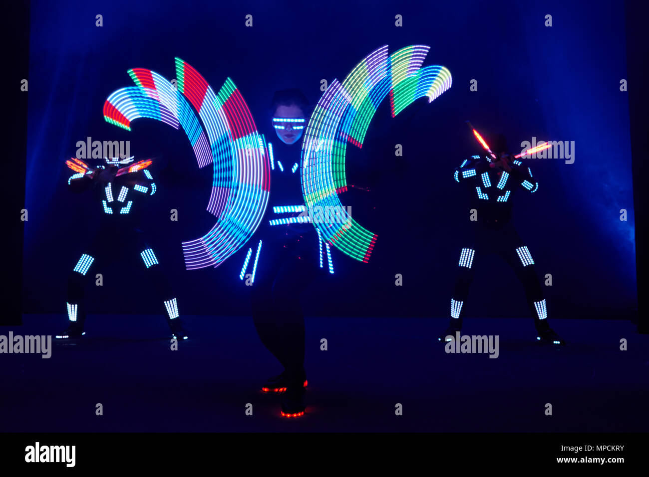 Laser show performance, dancers in led suits with LED lamp, very ...