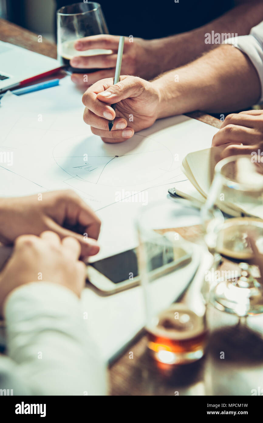 The hands of people working and relaxing in pub Stock Photo - Alamy