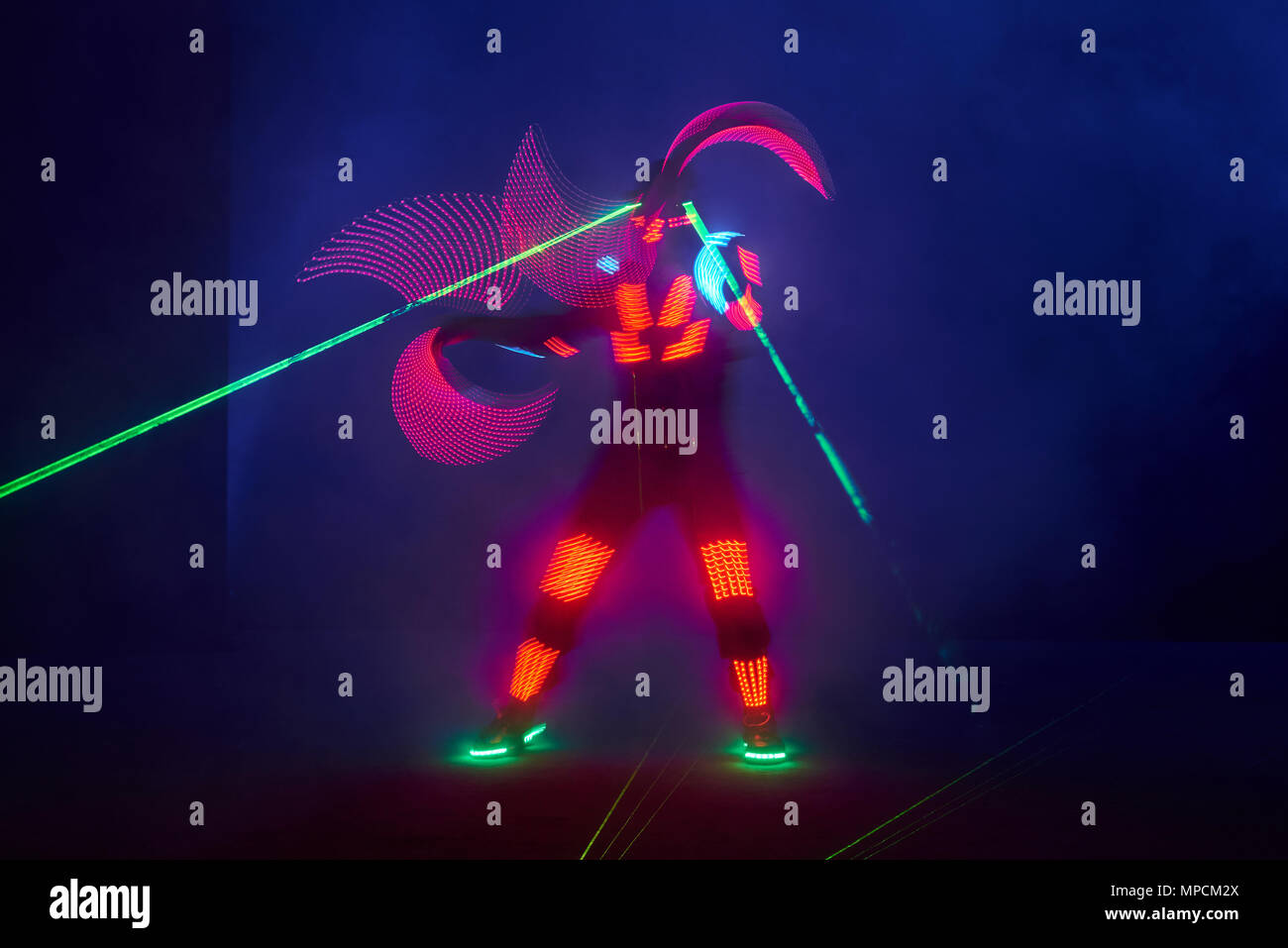 Laser show performance, dancers in led suits with LED lamp, very ...