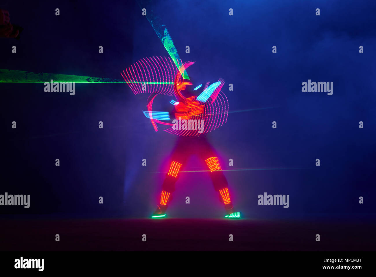 Laser show performance, dancers in led suits with LED lamp, very ...