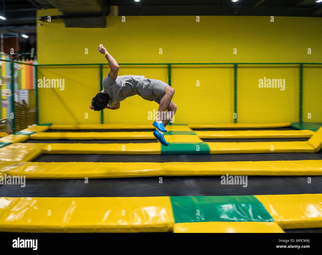 trampoline jumper performs acrobatic exercises on the trampoline Stock ...