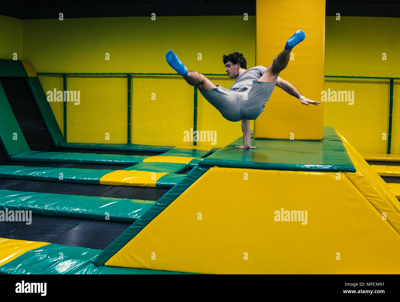 trampoline jumper performs acrobatic exercises on the trampoline Stock ...