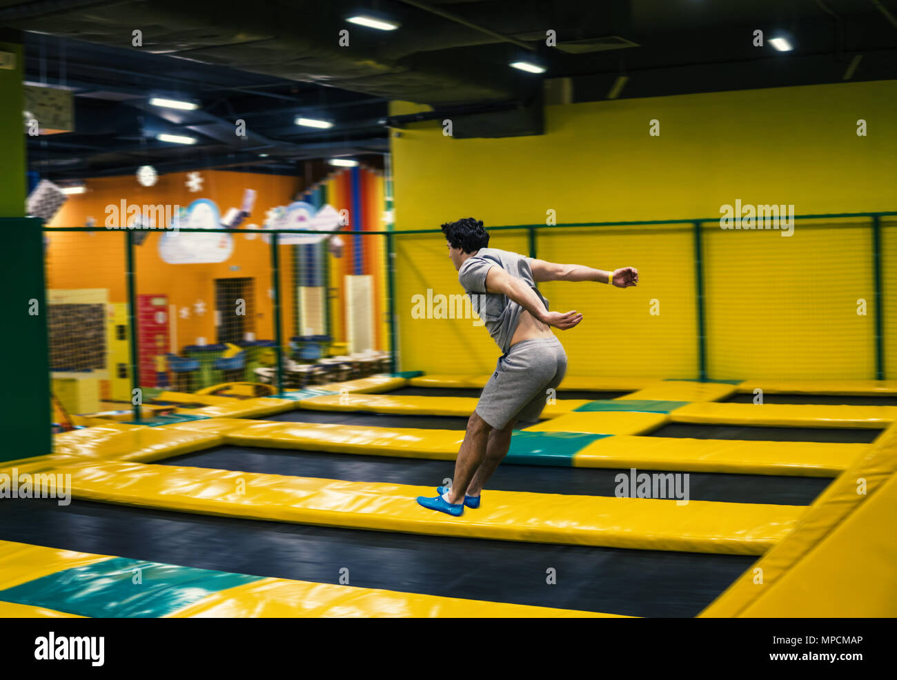 trampoline jumper performs acrobatic exercises on the trampoline Stock ...