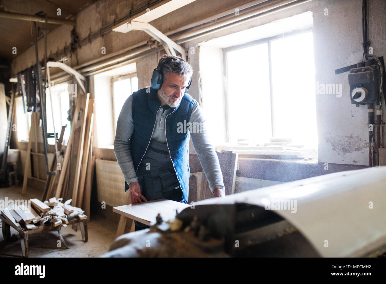 Man planning wood in workshop hi-res stock photography and images - Alamy