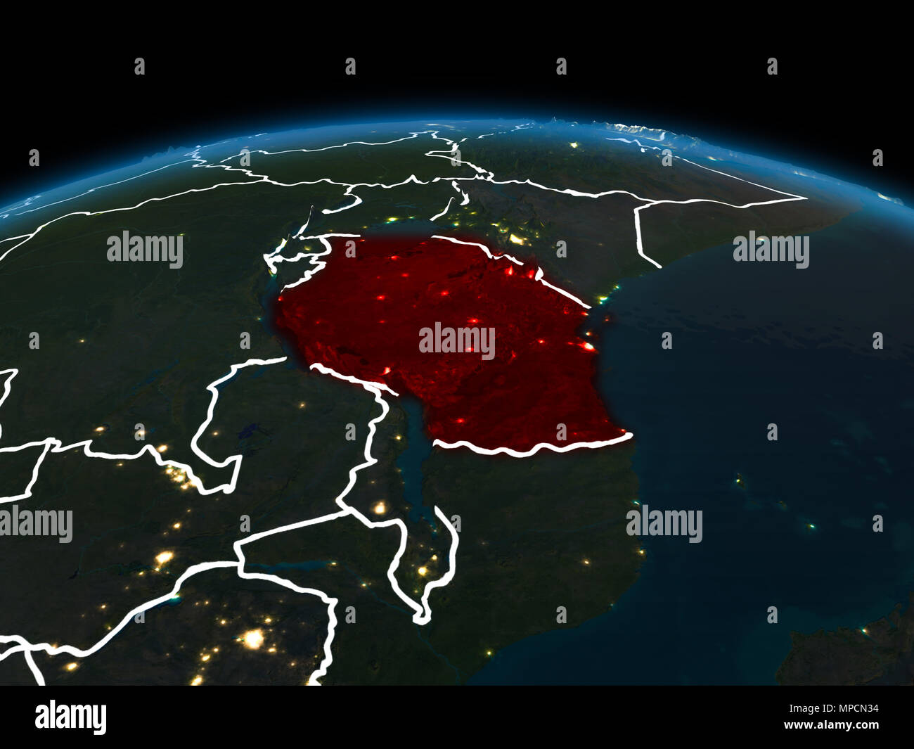 Space orbit view of Tanzania highlighted in red on planet Earth at night with visible country ...