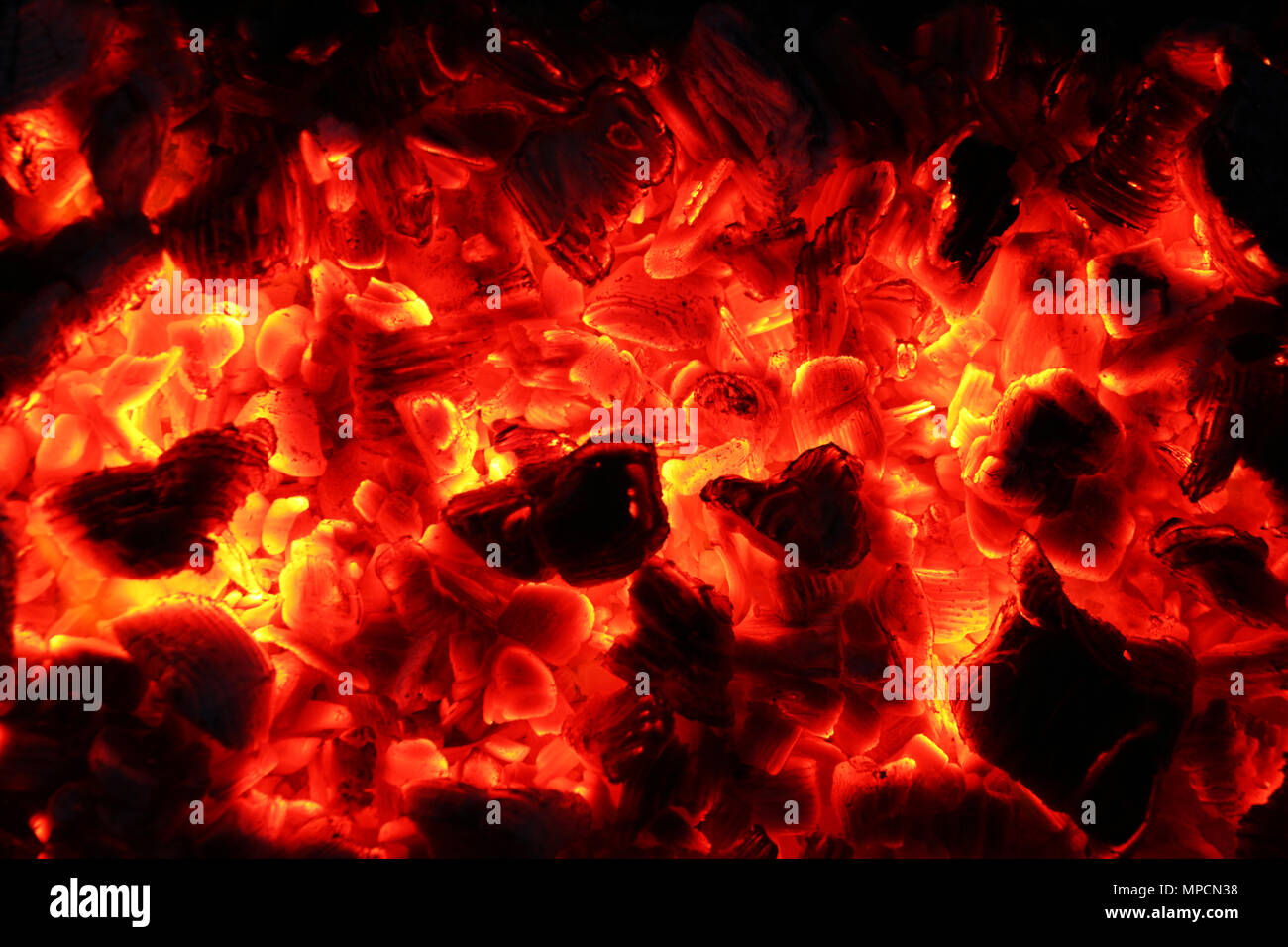 Ash fire in dark night. Campfire coals burn in the darkness. Ejection ...