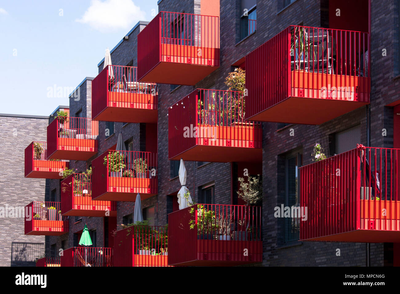 Germany, Cologne, red balconies of the apartment building Clouth 3 in ...