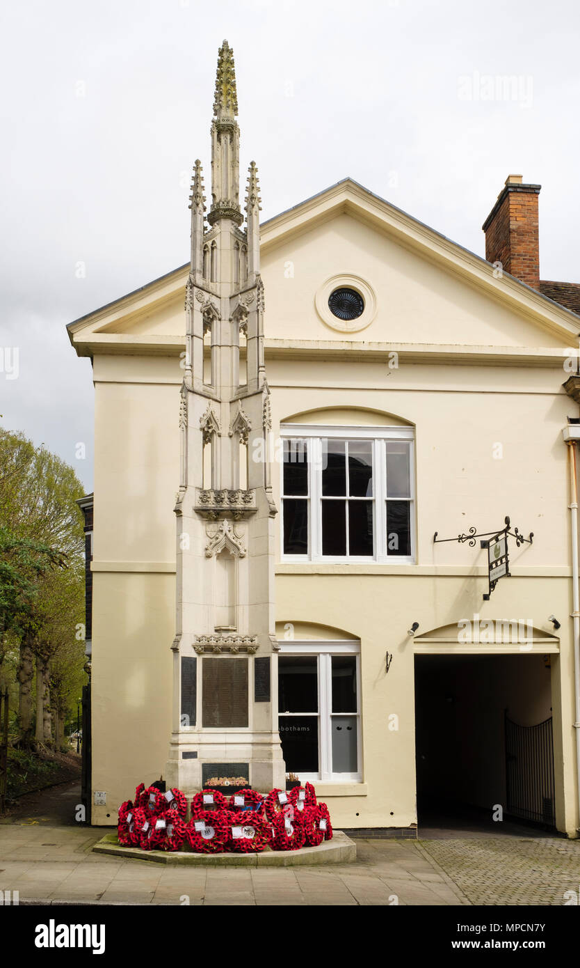 War memorial with poppy wreathes outside the Old Library building ...