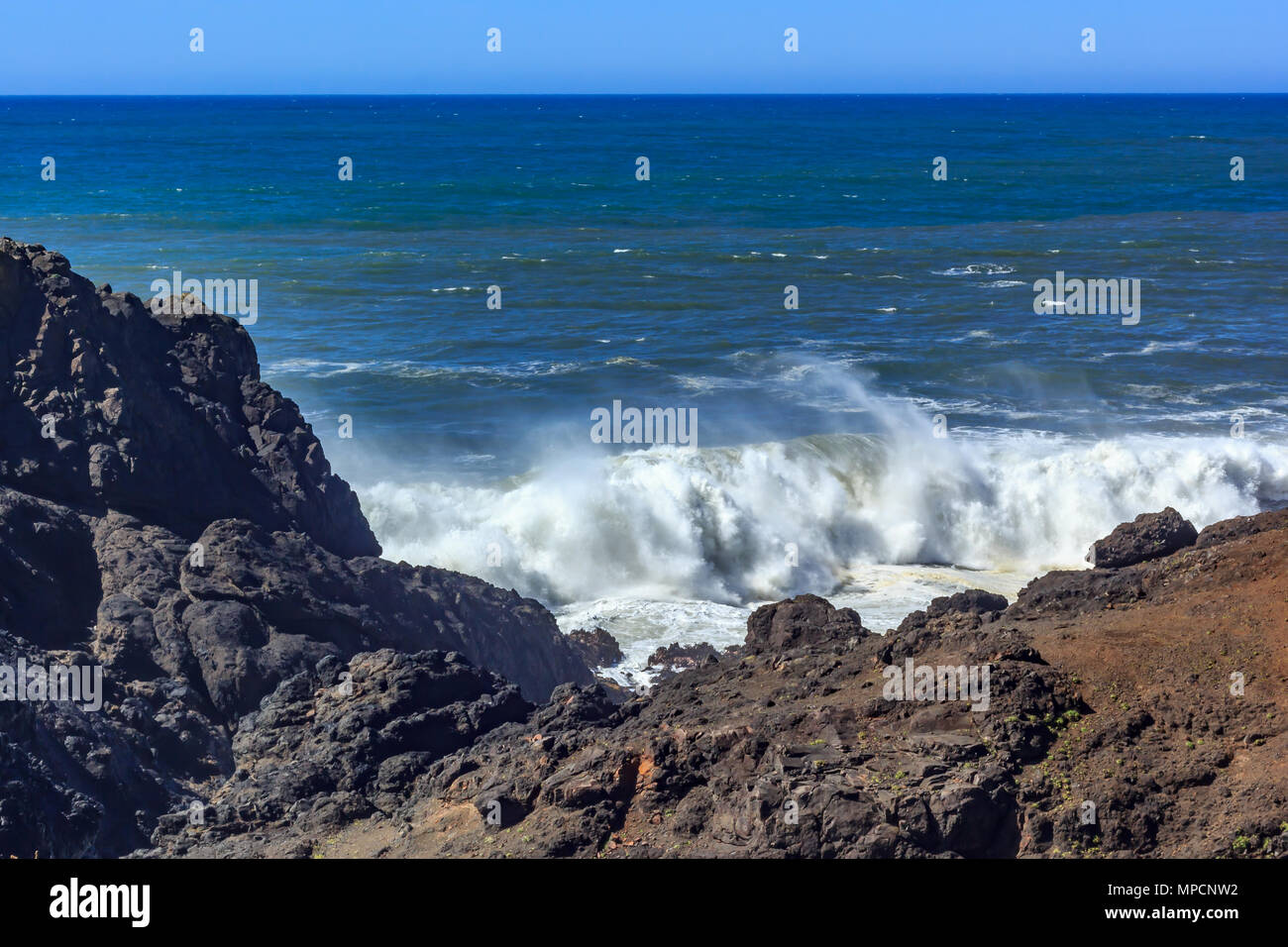 waves crashing over rocks Stock Photo - Alamy