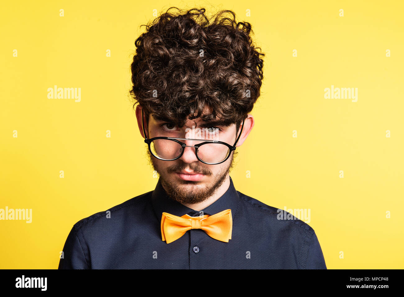 Portrait young man in yellow hi-res stock photography and images - Alamy