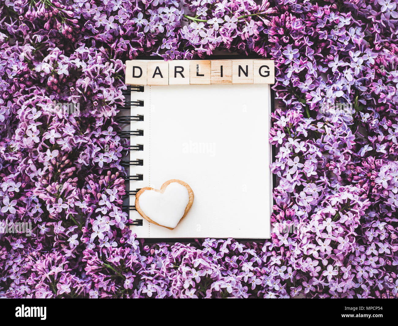 Heart-shaped cookie, covered with bright glaze, word DARLING ...