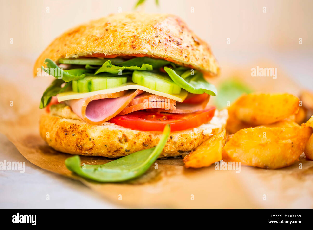 Ham burger or sandwich with ham slices,cheese, cucumbers, tomatoes and ...
