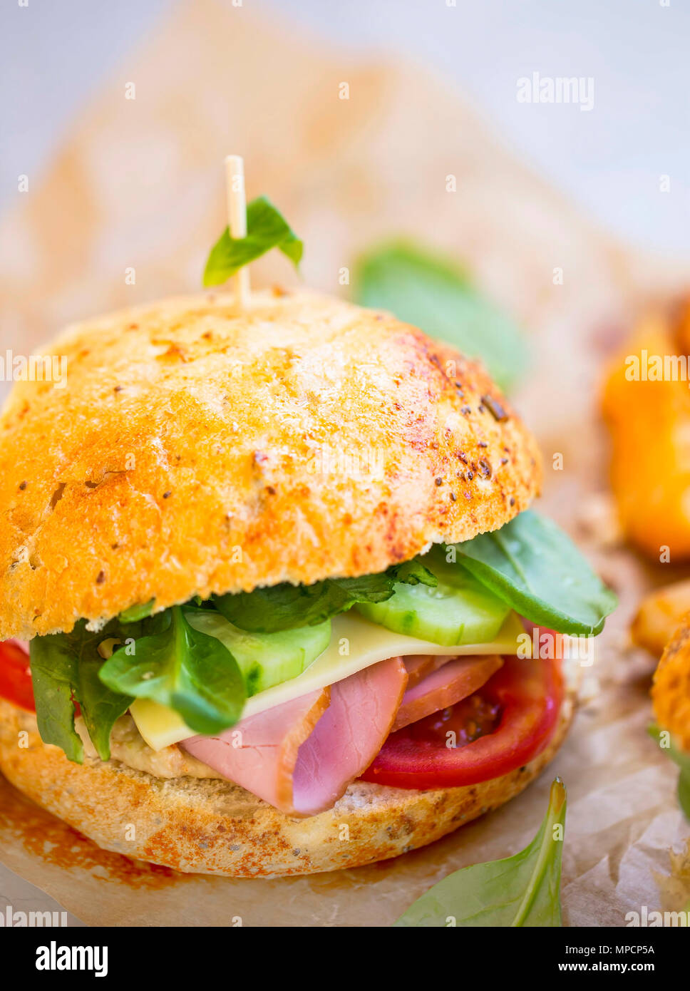 Ham burger or sandwich with ham slices,cheese, cucumbers, tomatoes and ...
