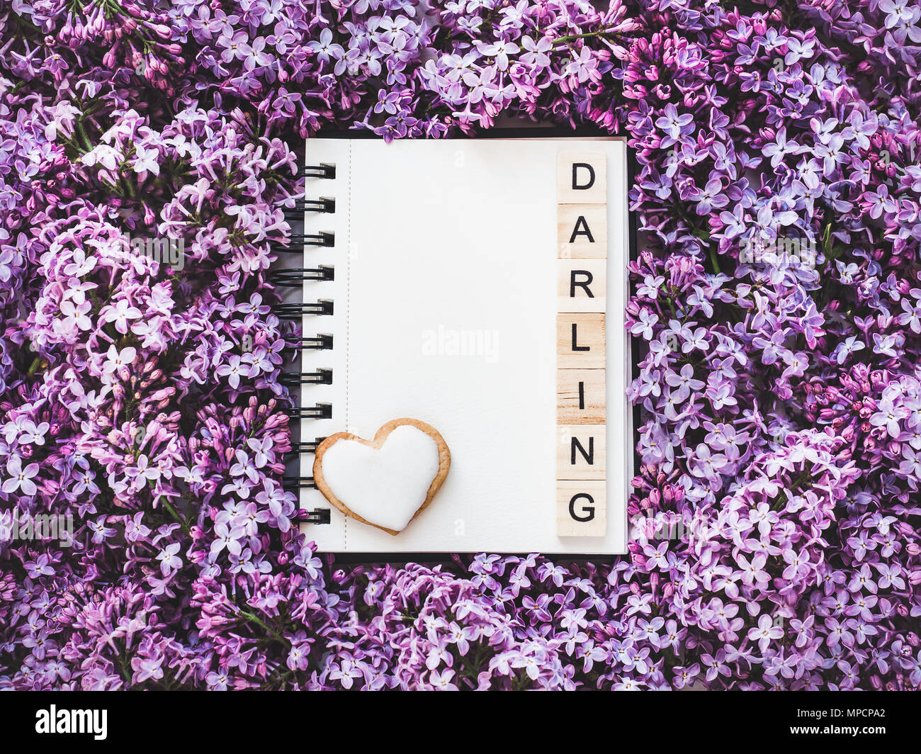 Heart-shaped cookie, covered with bright glaze, word DARLING ...