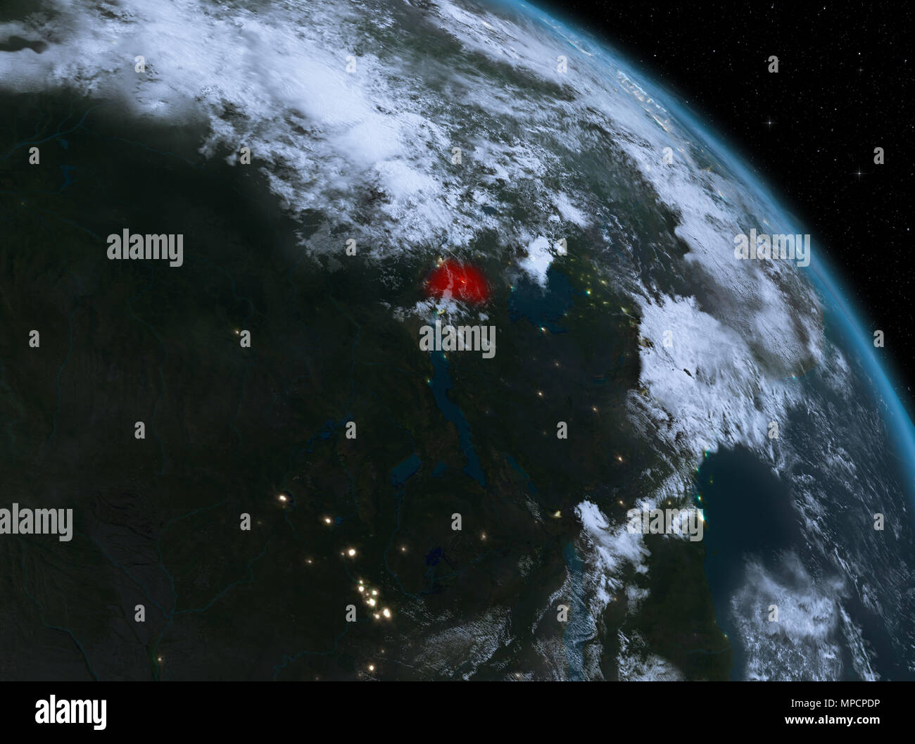 Night above Rwanda highlighted in red on model of planet Earth in space ...