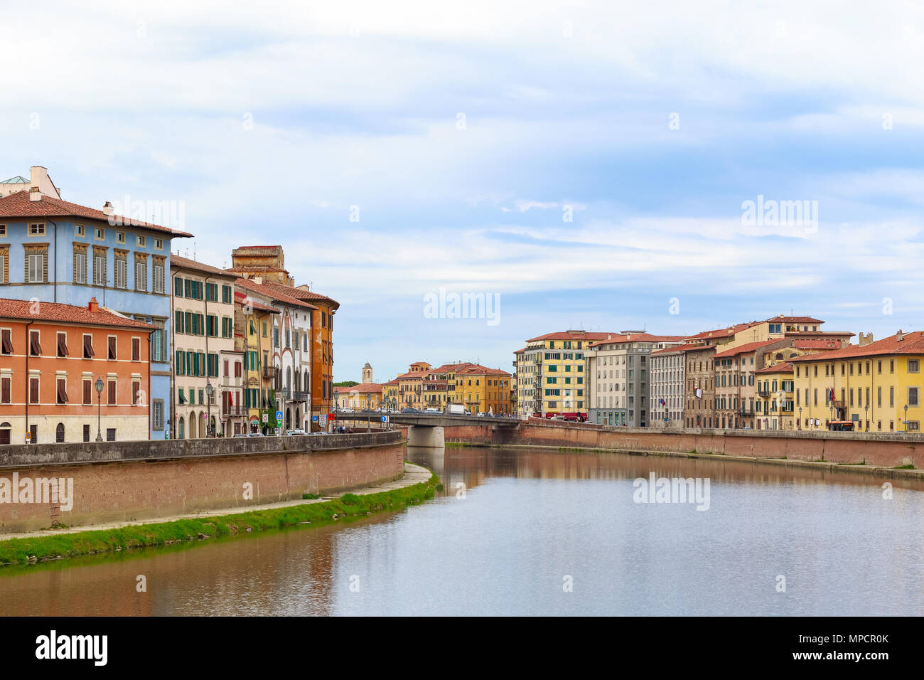View of riverside buildings at river Arno in Pisa, Italy Stock Photo ...