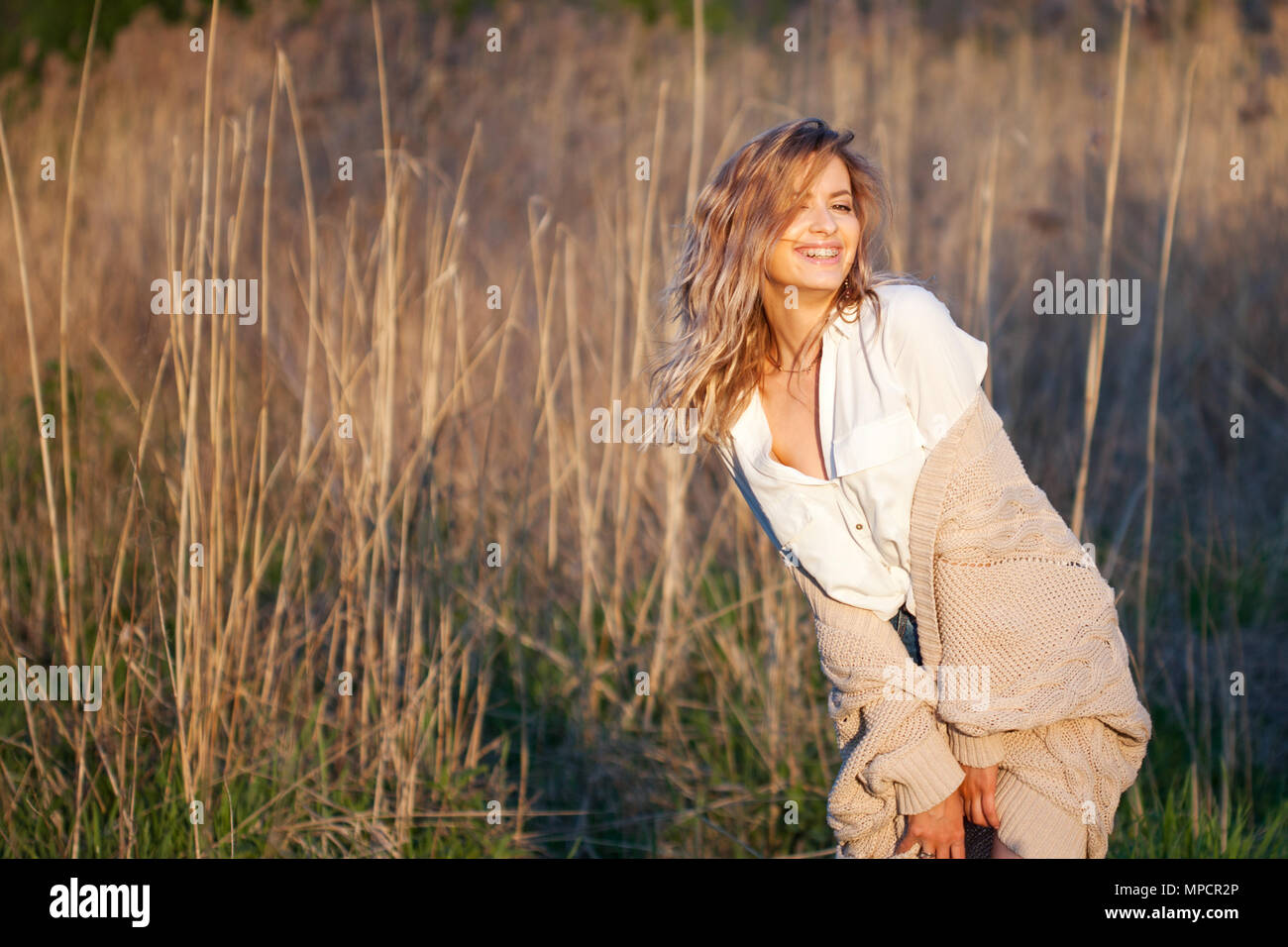 Girl is running out. Young woman in the field, feel freedom and ...