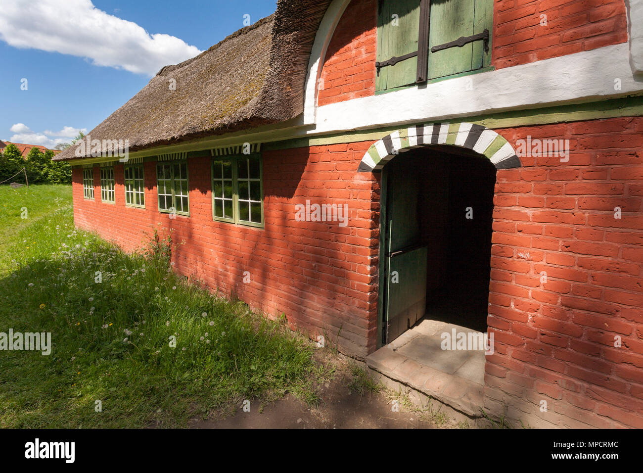 Red brick barn at the Folk Museum: A substantial red brick thatched ...