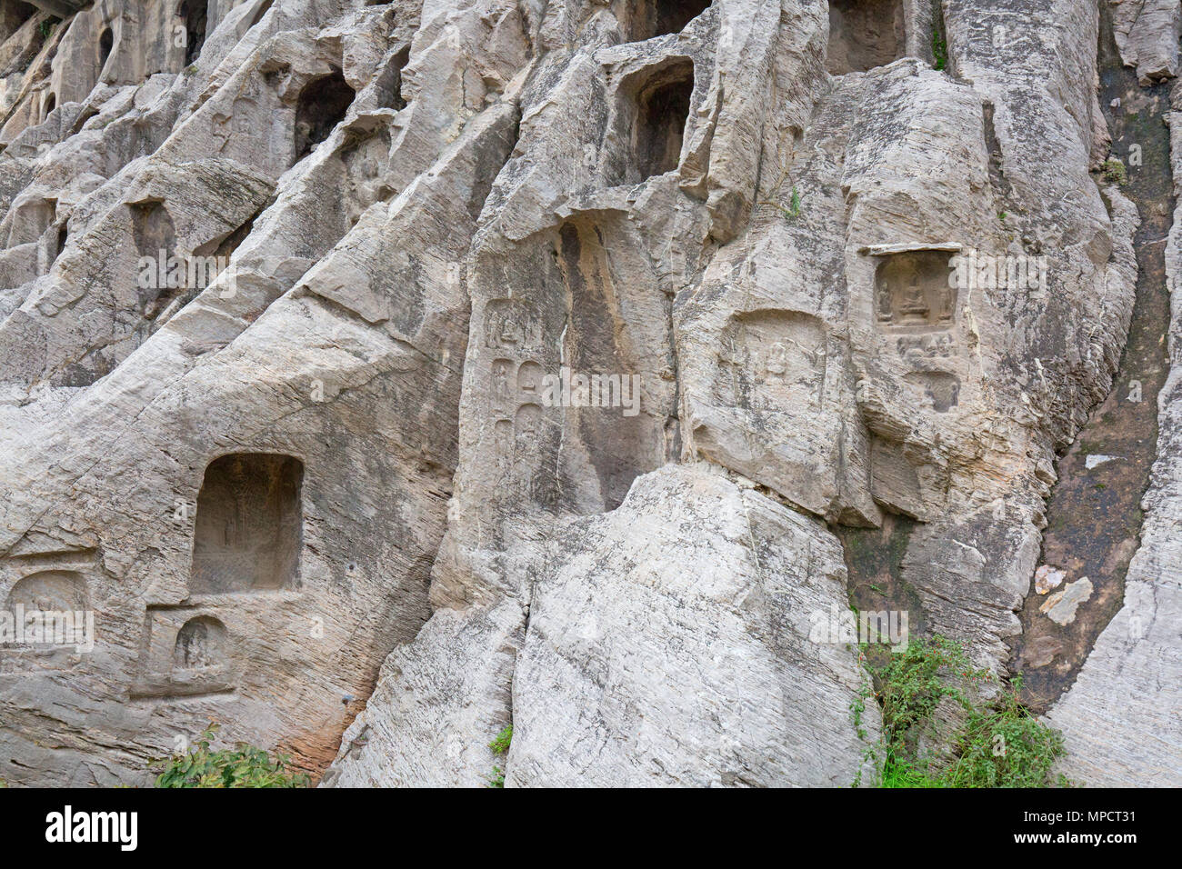 Famous Longmen Grottoes (statues of Buddha and Bodhisattvas carved in ...