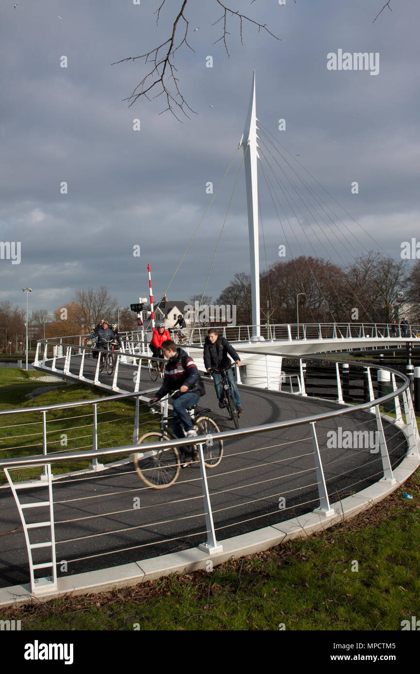 People riding a bike on the bike bridge Stock Photo - Alamy
