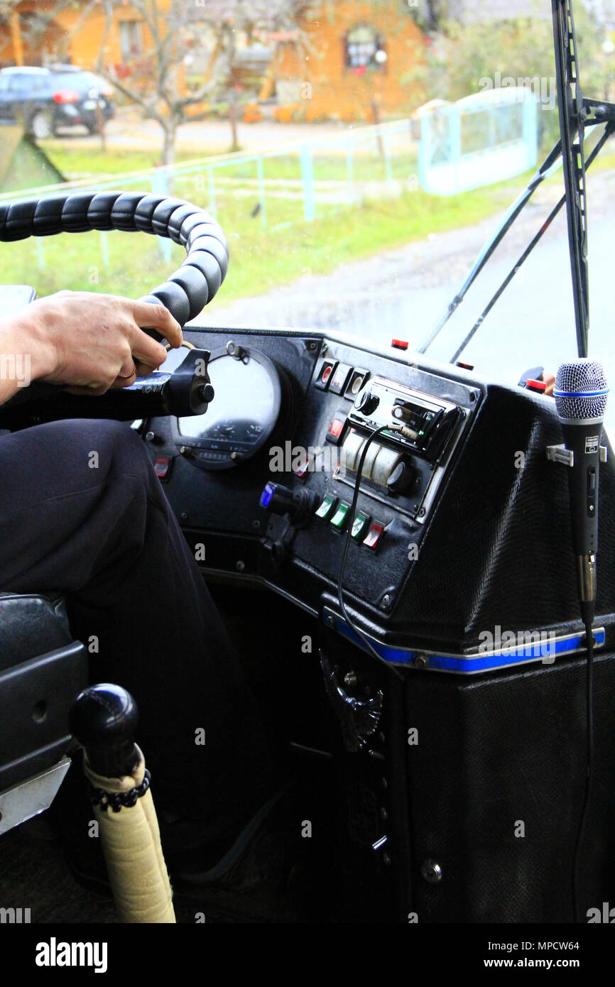 Driver is driving bus. Dashboard in the bus Stock Photo - Alamy