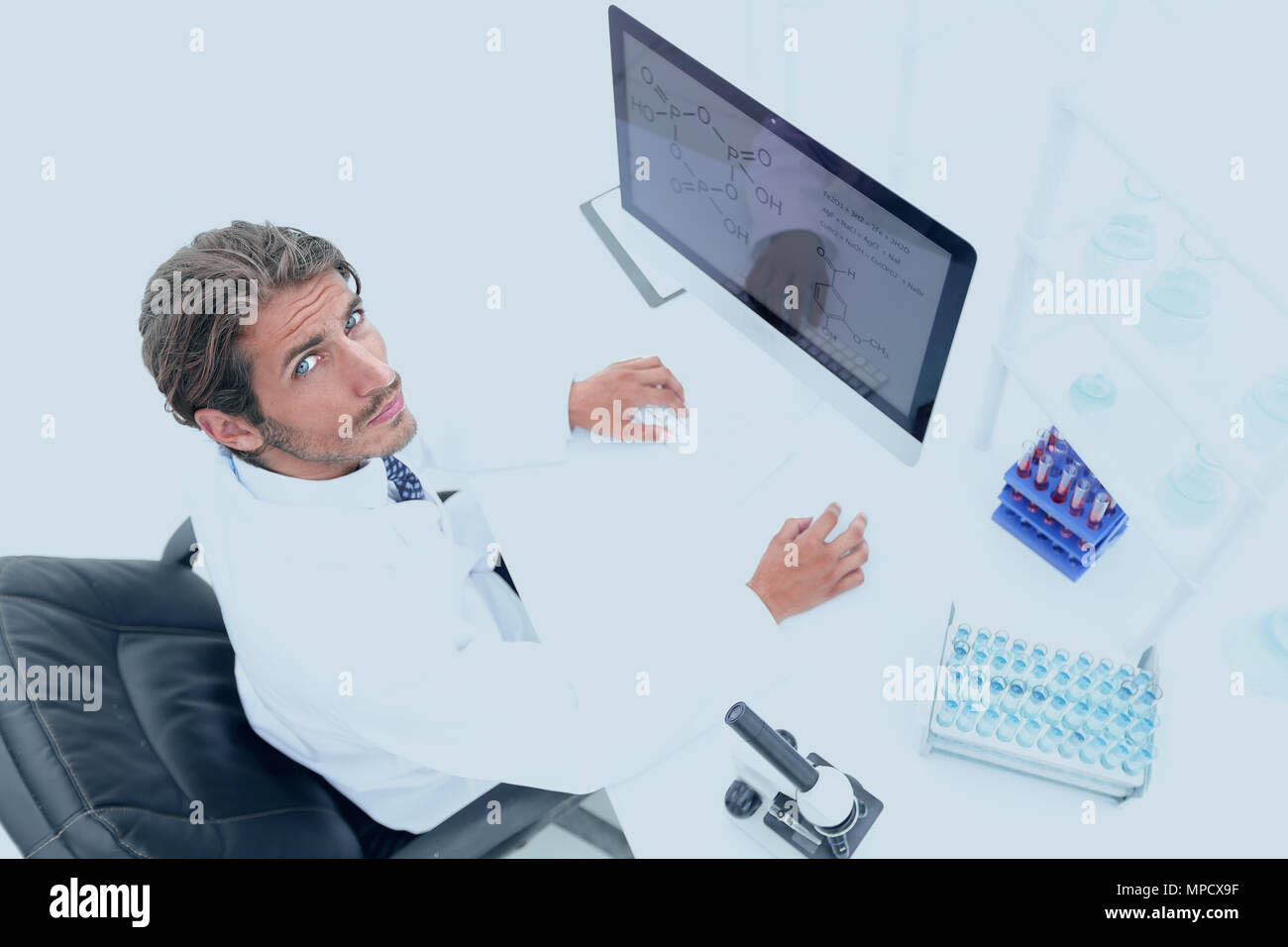 view from above of the scientist-doctor sitting on the computer Stock ...