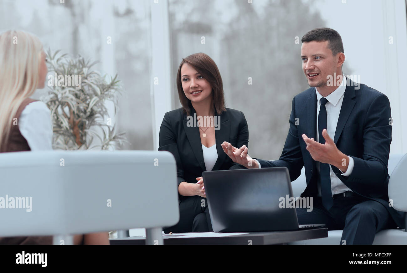 business team talking in office lobby Stock Photo - Alamy