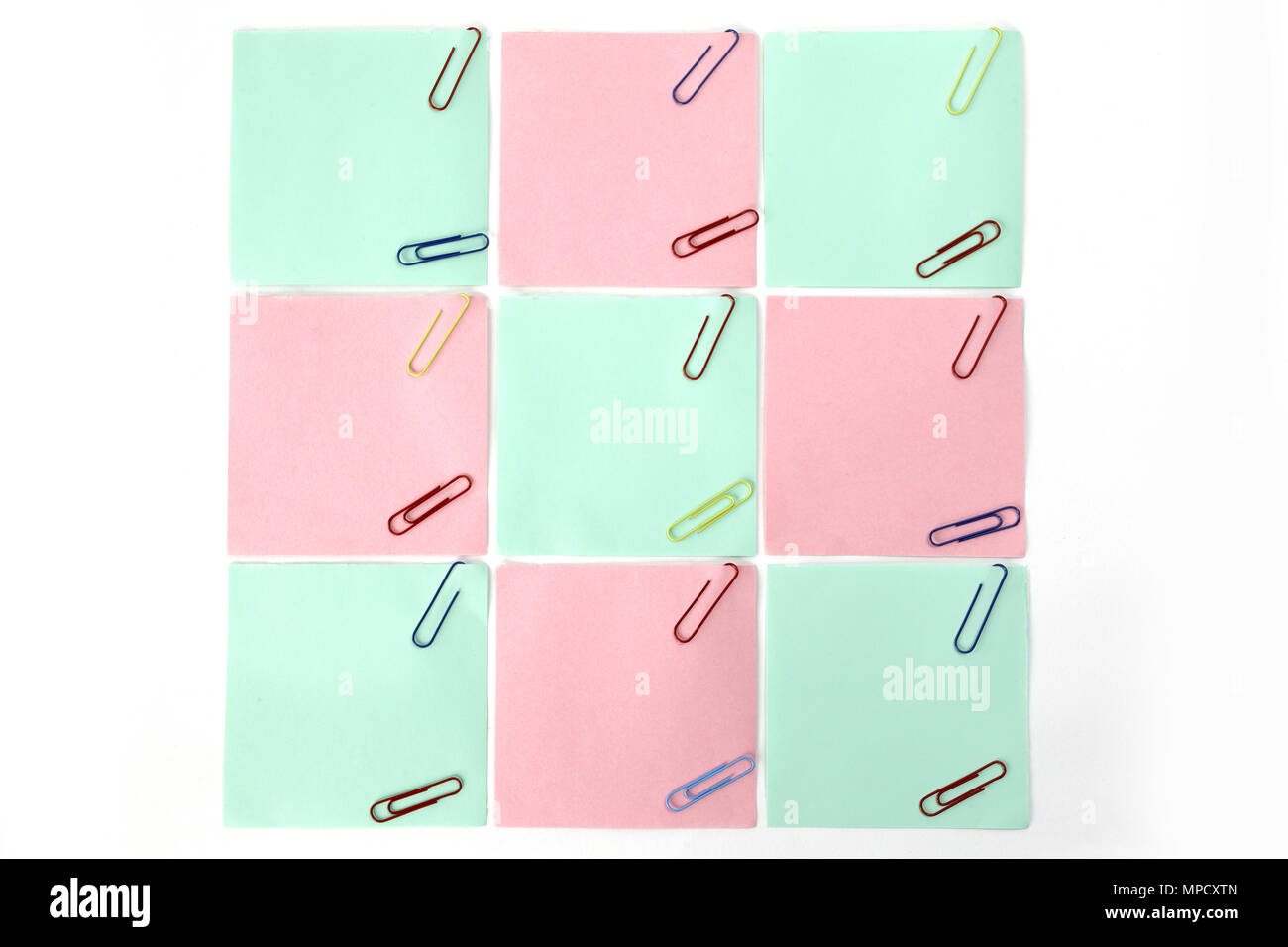 multiple blank sheets for notes with paper clips isolated on white ...