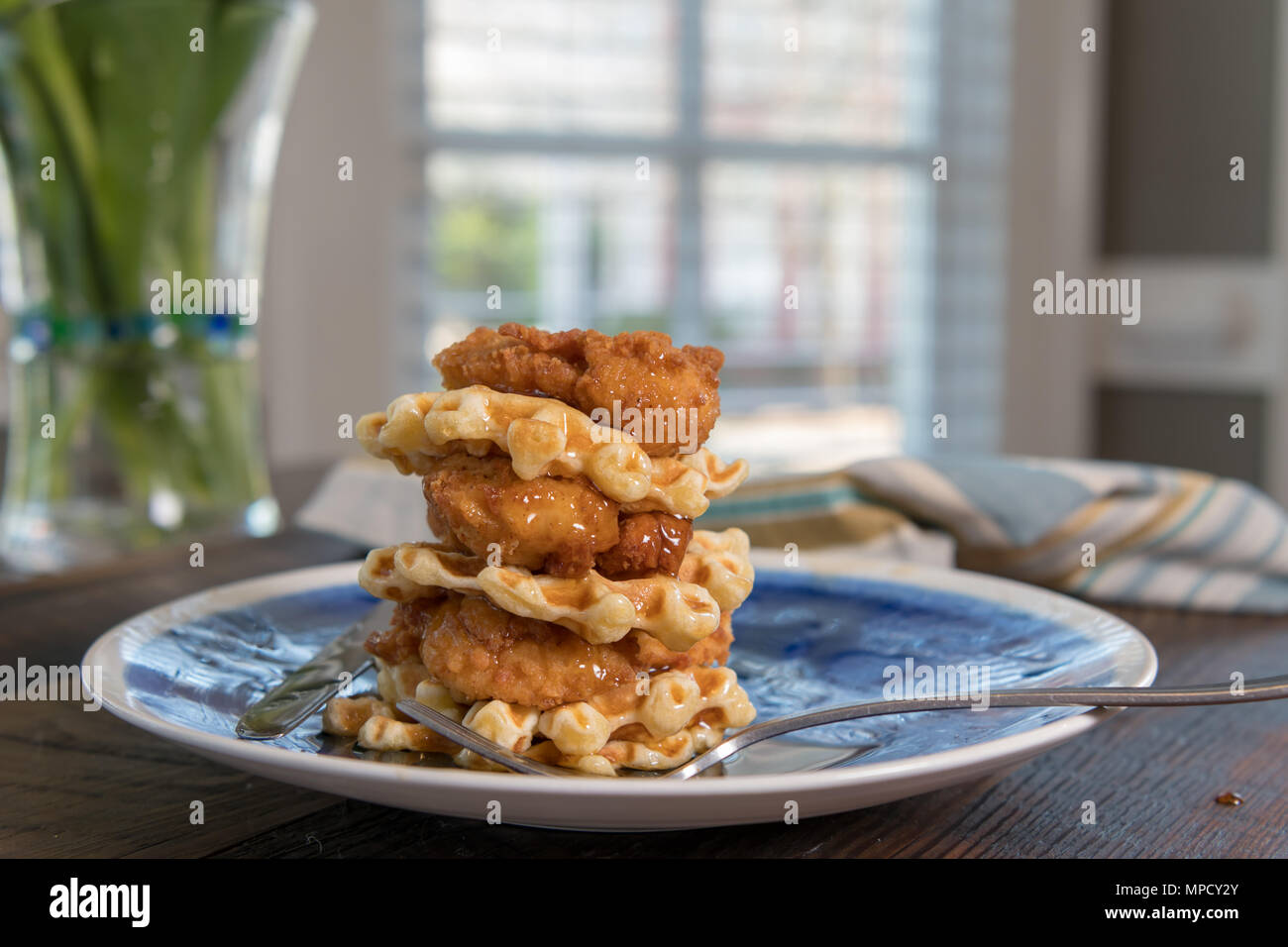 Chicken and Waffles Stack Half Eaten during Middle of Meal Stock Photo ...